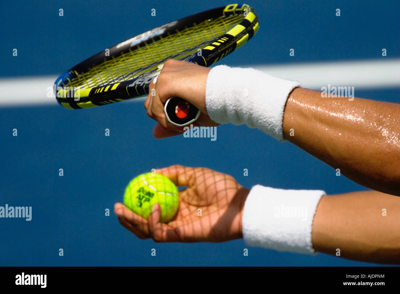 Tennis player prepares to serve ball to opponent Stock Photo - Alamy