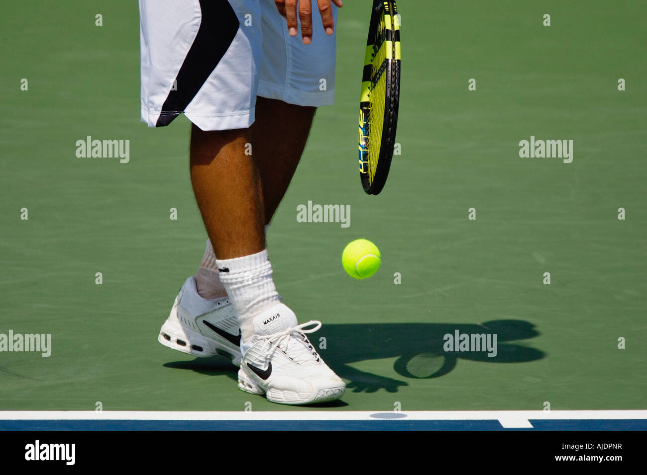 Professional tennis player prepares to serve ball to opponent Stock ...