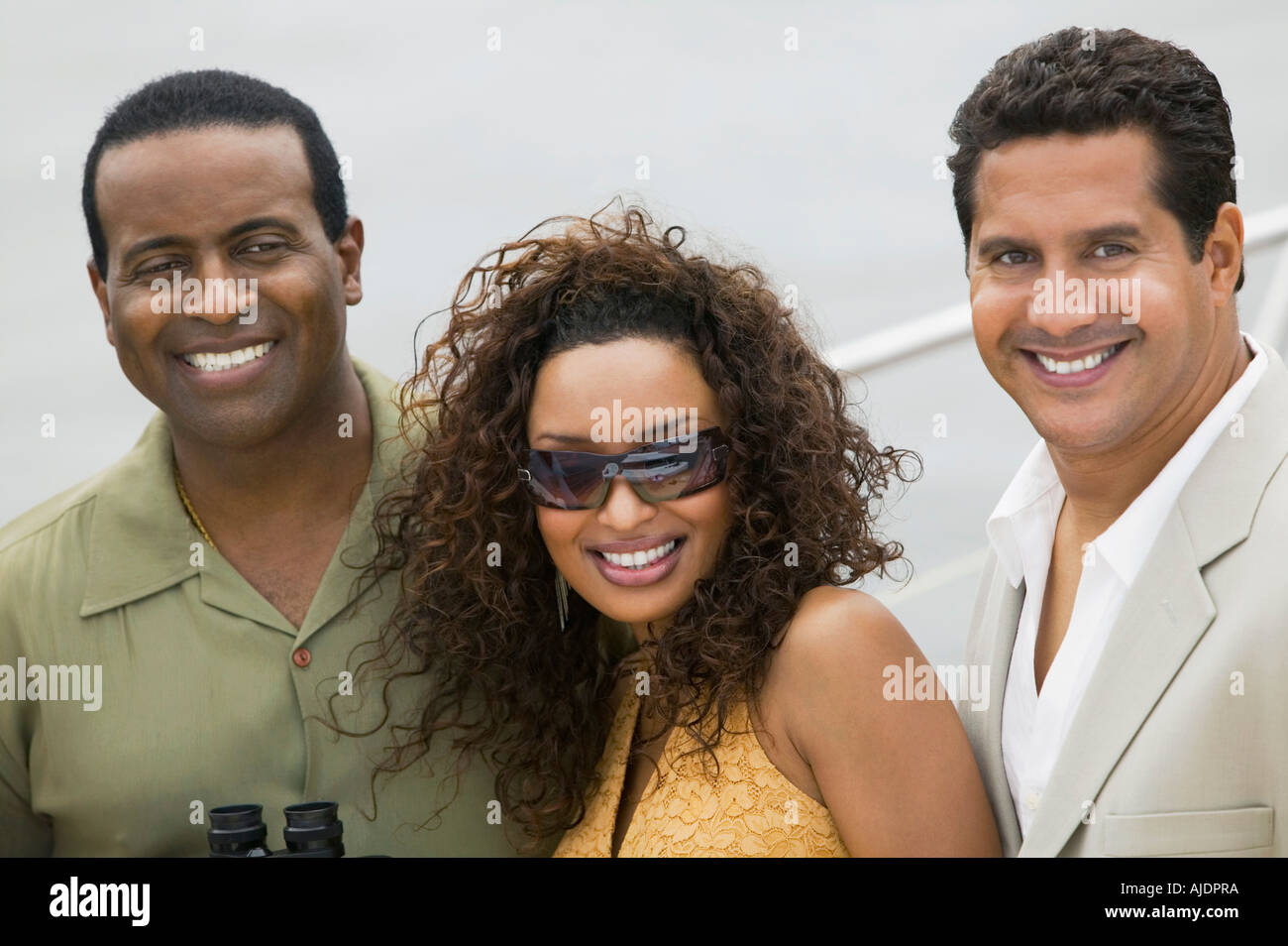 Couple with friend on yacht, (portrait Stock Photo - Alamy
