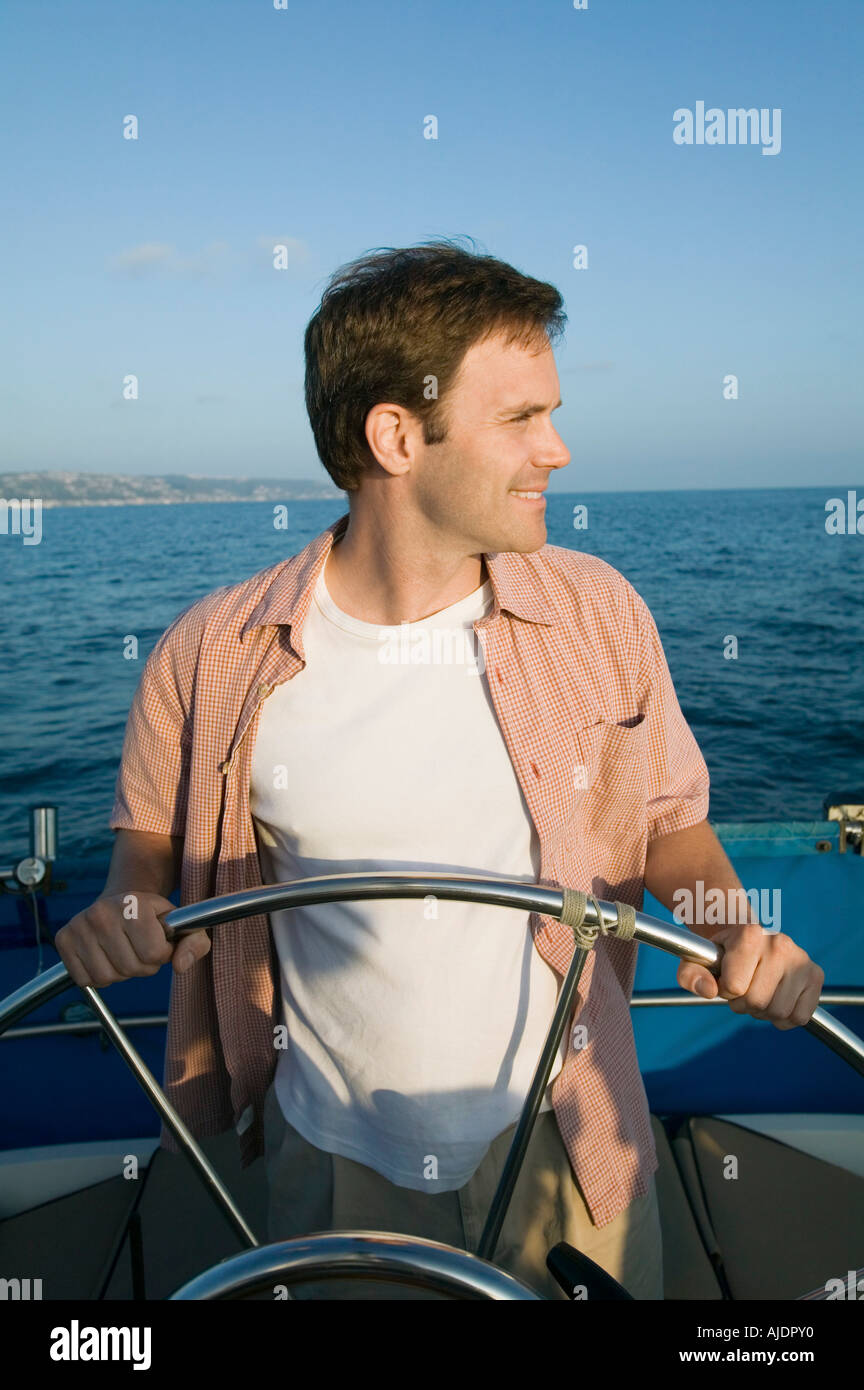 Man at helm hi-res stock photography and images - Alamy