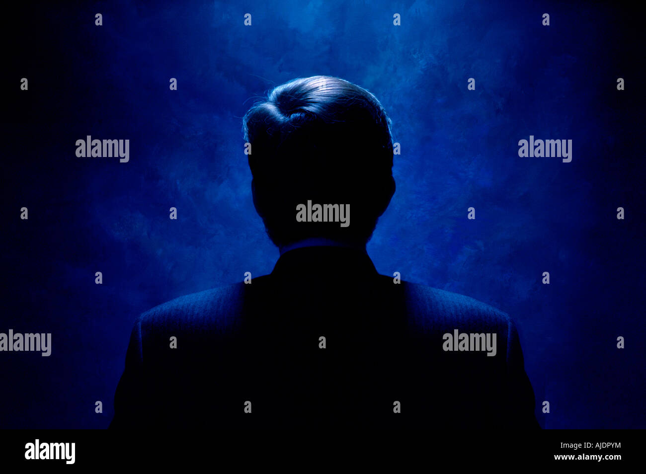 Mystery silhouette of mysterious man bathed in blue light Stock Photo ...