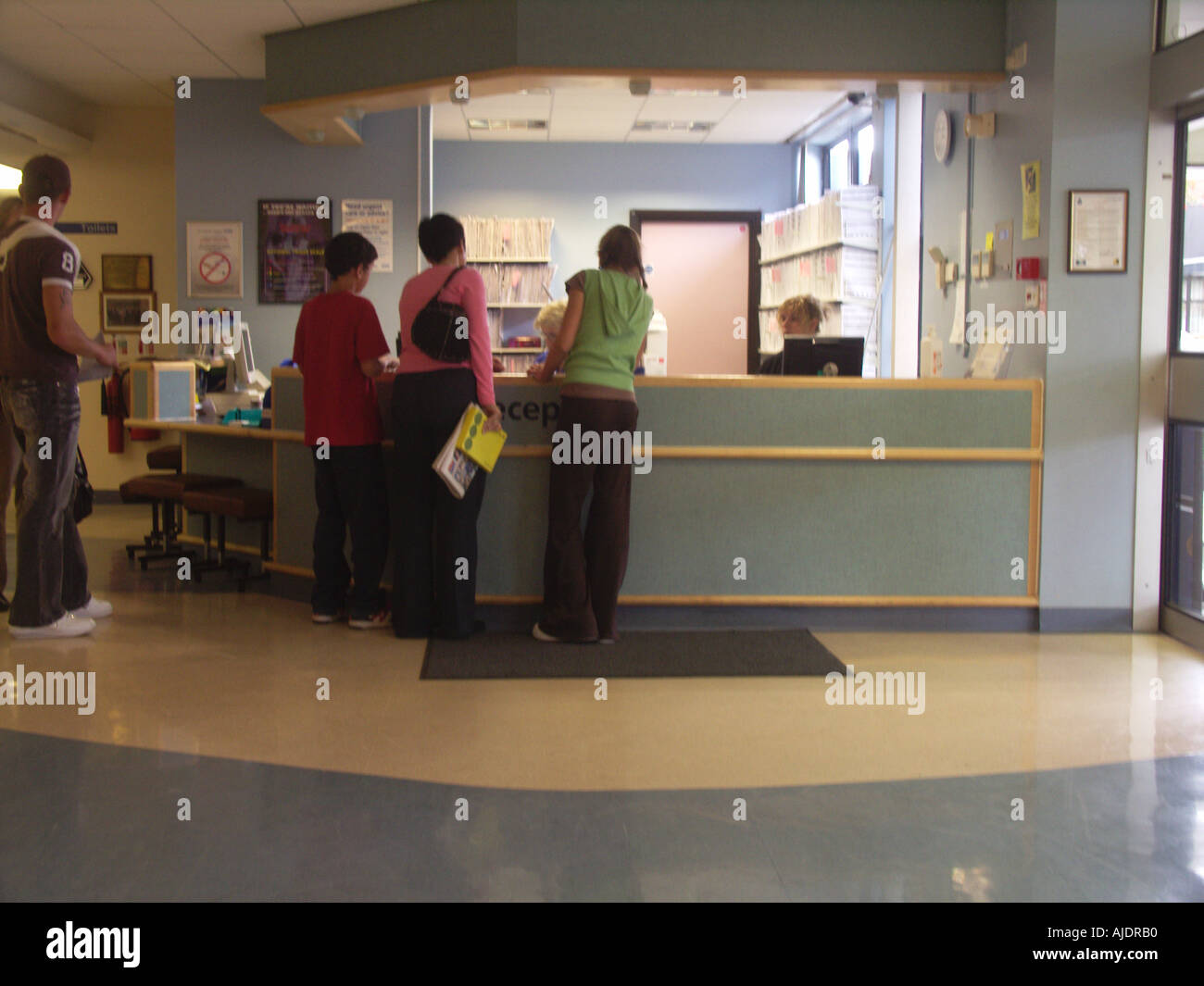 Reception desk at British NHS hospital Stock Photo - Alamy