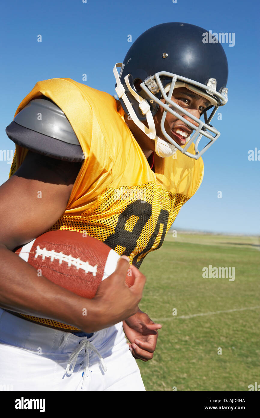 Running the football hi-res stock photography and images - Alamy