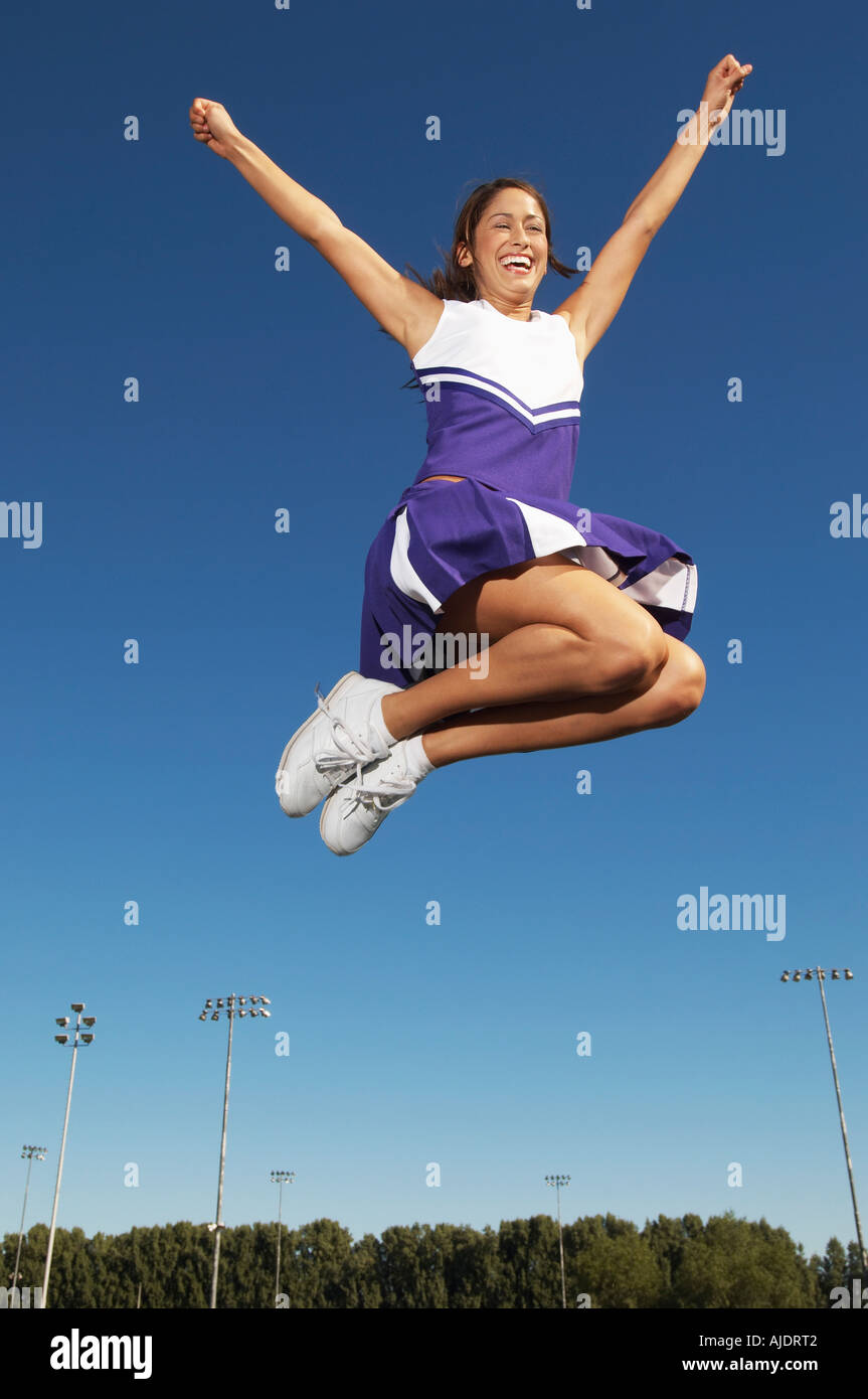 Low angle view cheerleader jumping hi-res stock photography and images ...