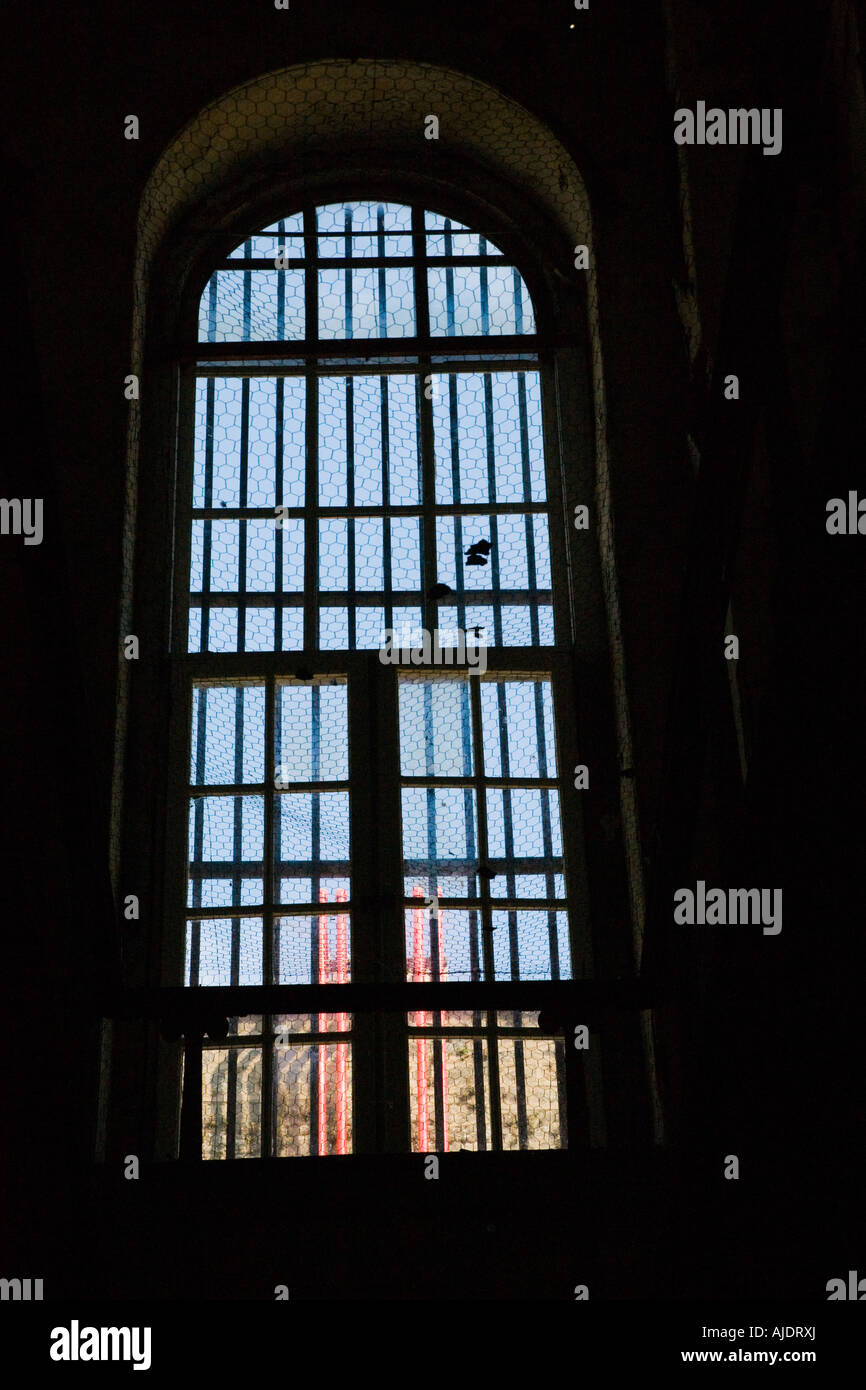 A barred window in a hallway of Eastern State Penitentiary looks out ...