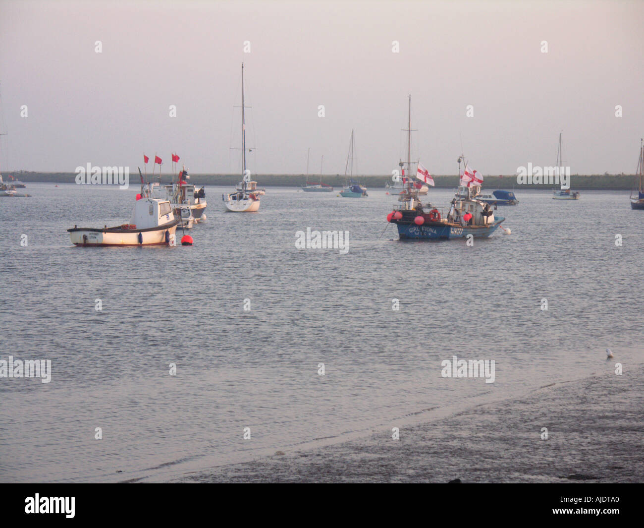 Boats at anchor Orford quay Suffolk England Stock Photo - Alamy