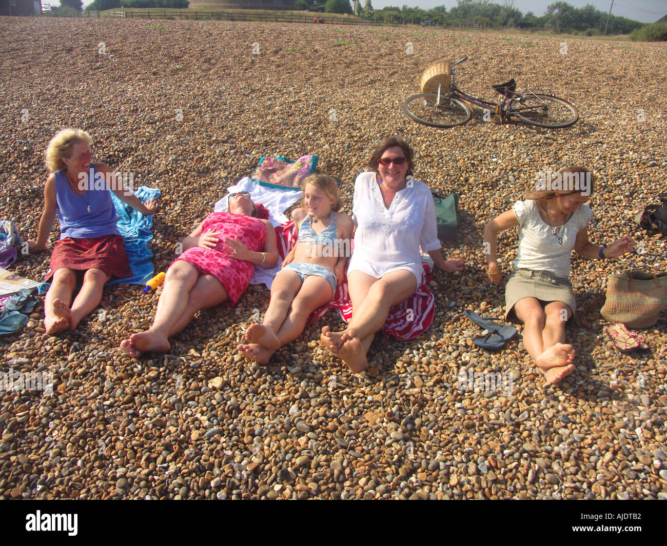 Group women sunbathe on beach hi-res stock photography and images - Alamy