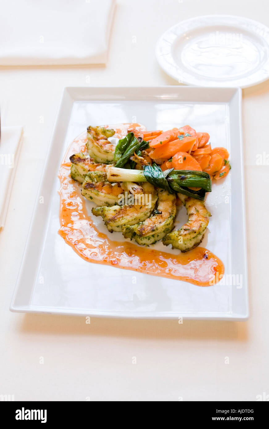 A dish of prawns with vegetables on plate Stock Photo - Alamy