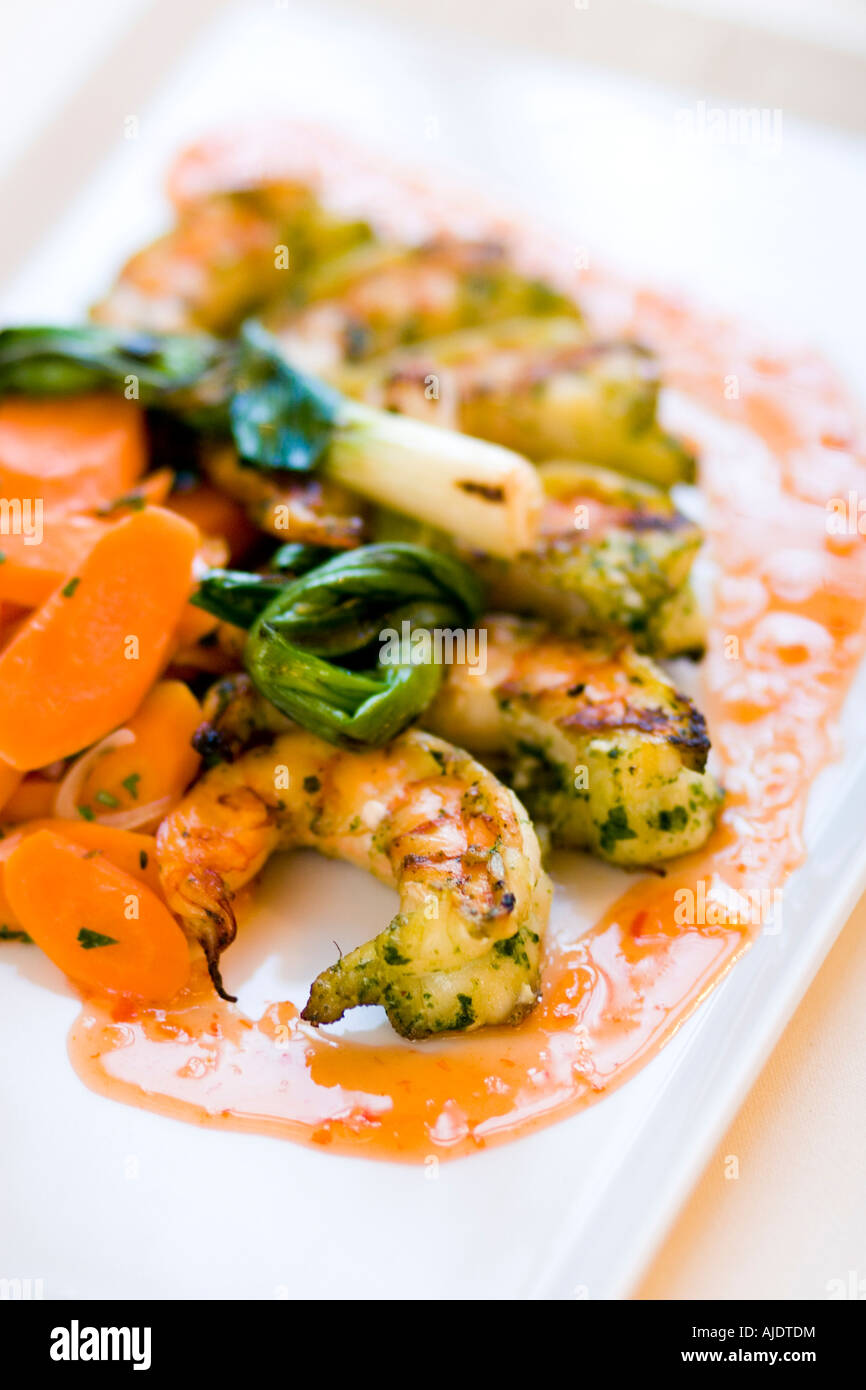 A dish of prawns with vegetables on plate Stock Photo - Alamy