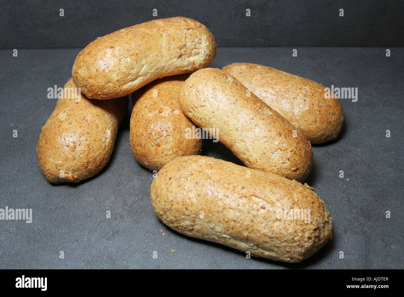 fresh bread buns on grey tiles Stock Photo - Alamy