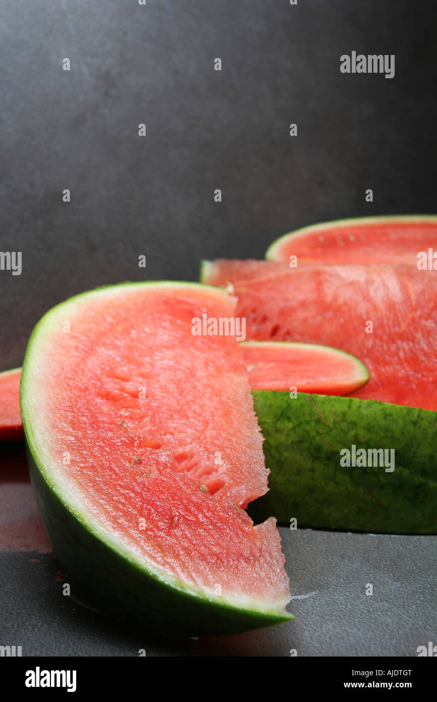 cut watermelon on a darkgrey background Stock Photo - Alamy