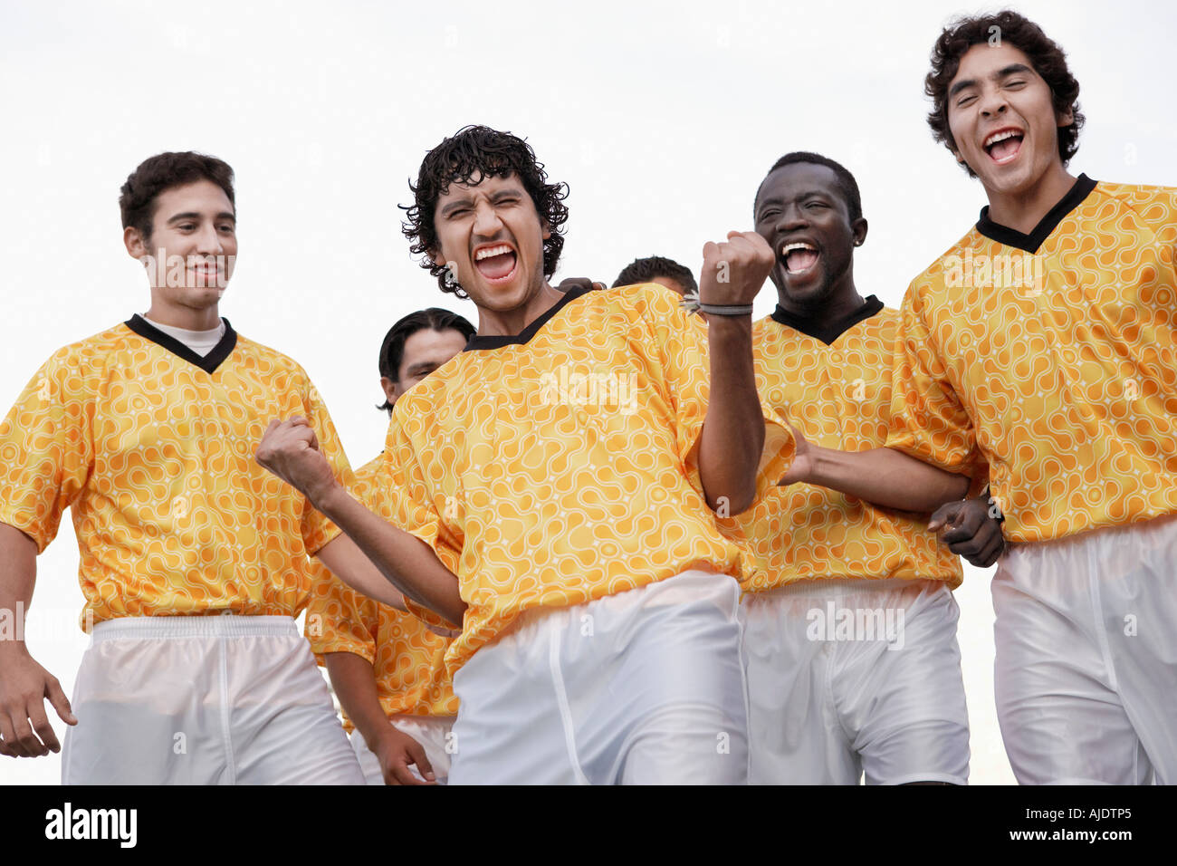 Cheering soccer team, portrait, low angle view Stock Photo - Alamy