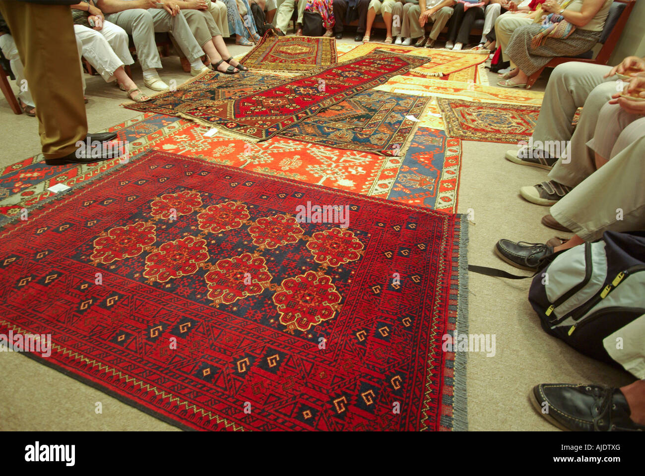 Istanbul tourists watching sales demonstration of traditional Turkish ...
