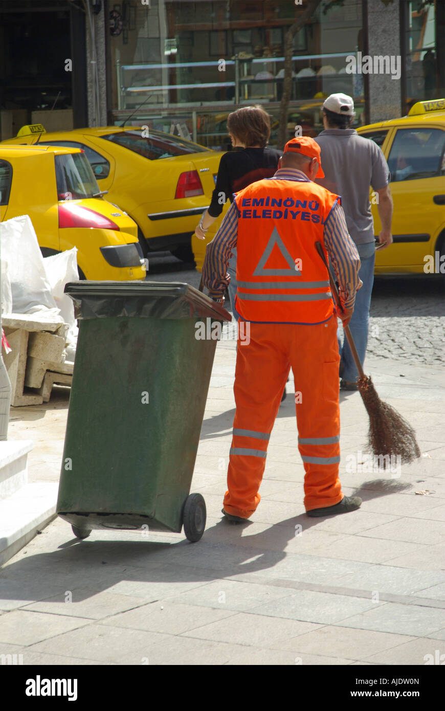 Istanbul pavement sweeper with wheelie bin Stock Photo - Alamy