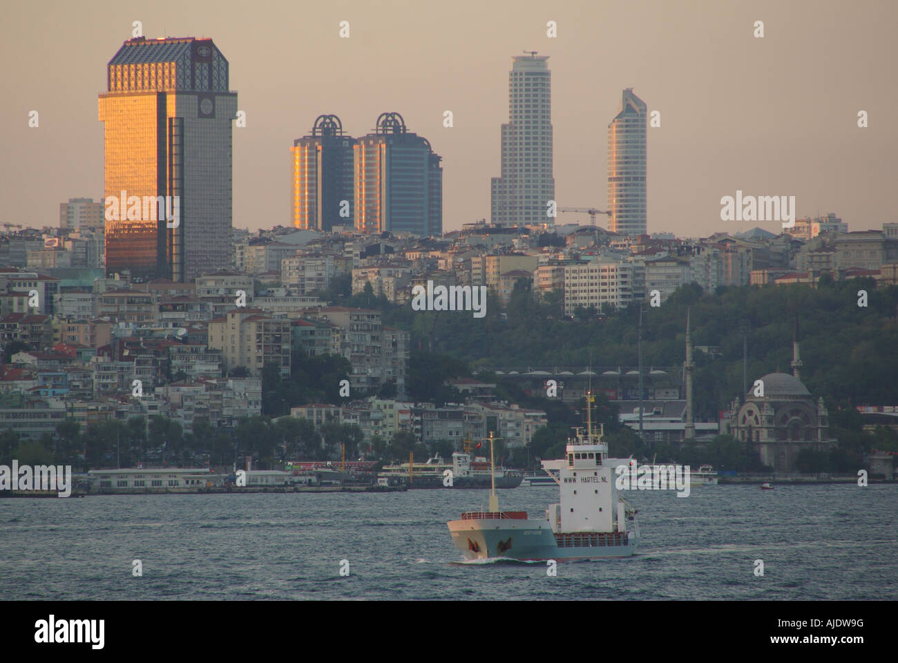 Istanbul Mosque sun glint on high rise buildings ship passing through ...