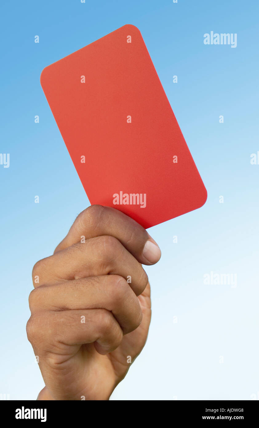 Soccer referee holding up red card, close-up on hand Stock Photo - Alamy
