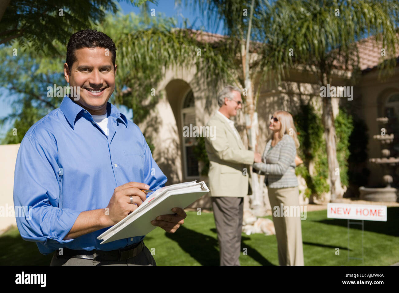 Smiling estate agent, portrait Stock Photo - Alamy
