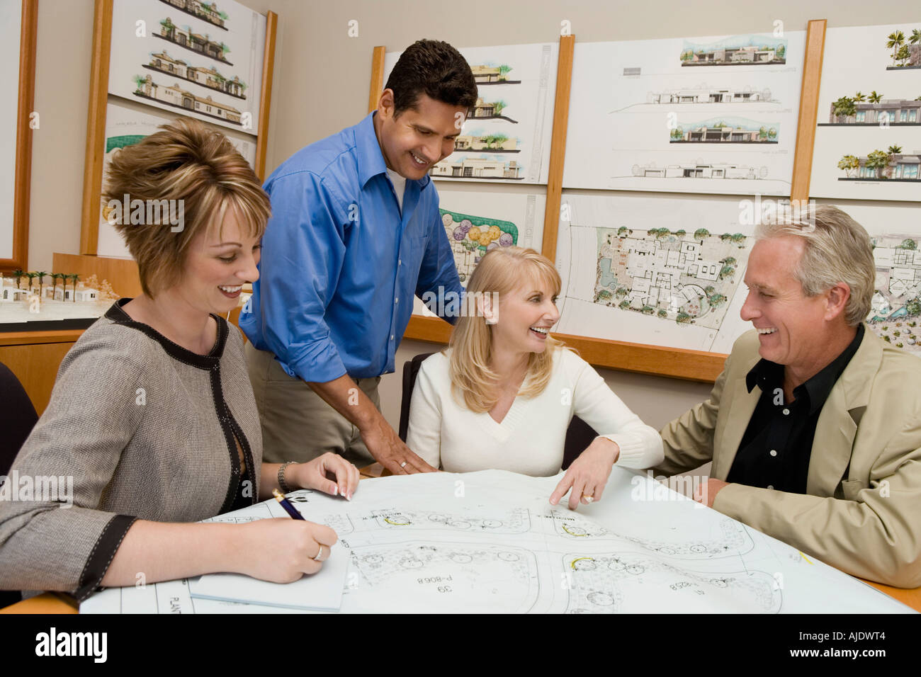 Two women meeting with architect and developer Stock Photo - Alamy