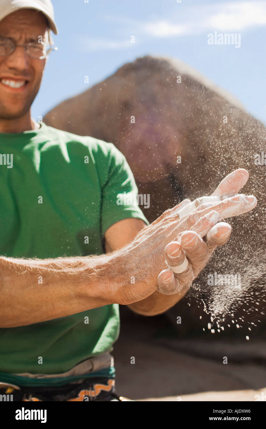 Climber Rubbing Chalk on Hands Stock Photo - Alamy