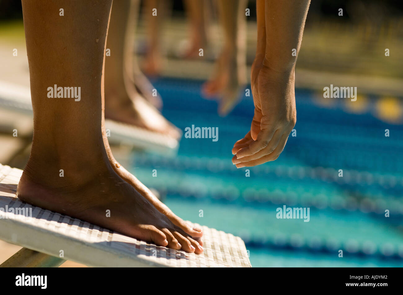 Female swimmers on starting blocks hi-res stock photography and images ...