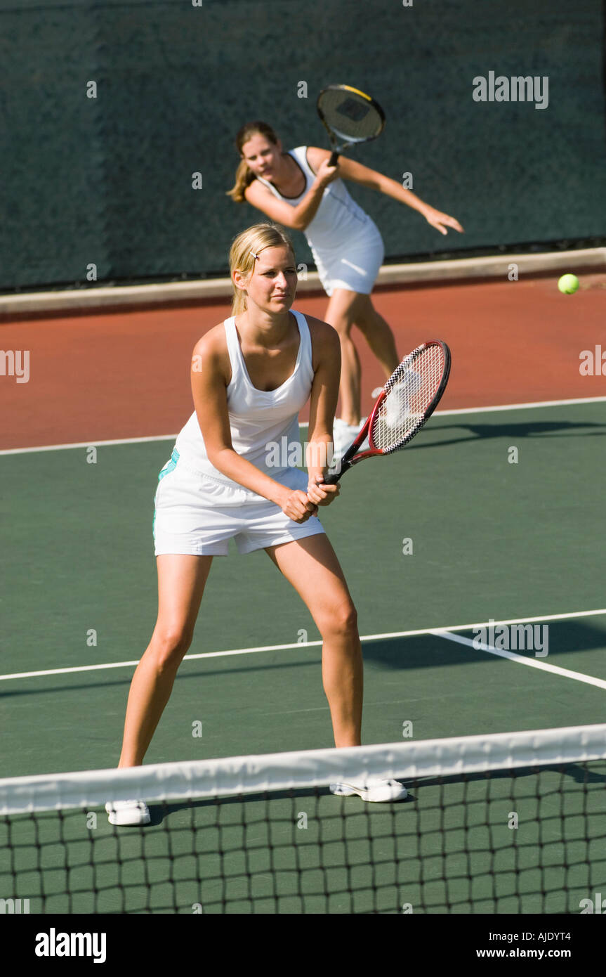 Tennis Player, returning serve in doubles game Stock Photo - Alamy