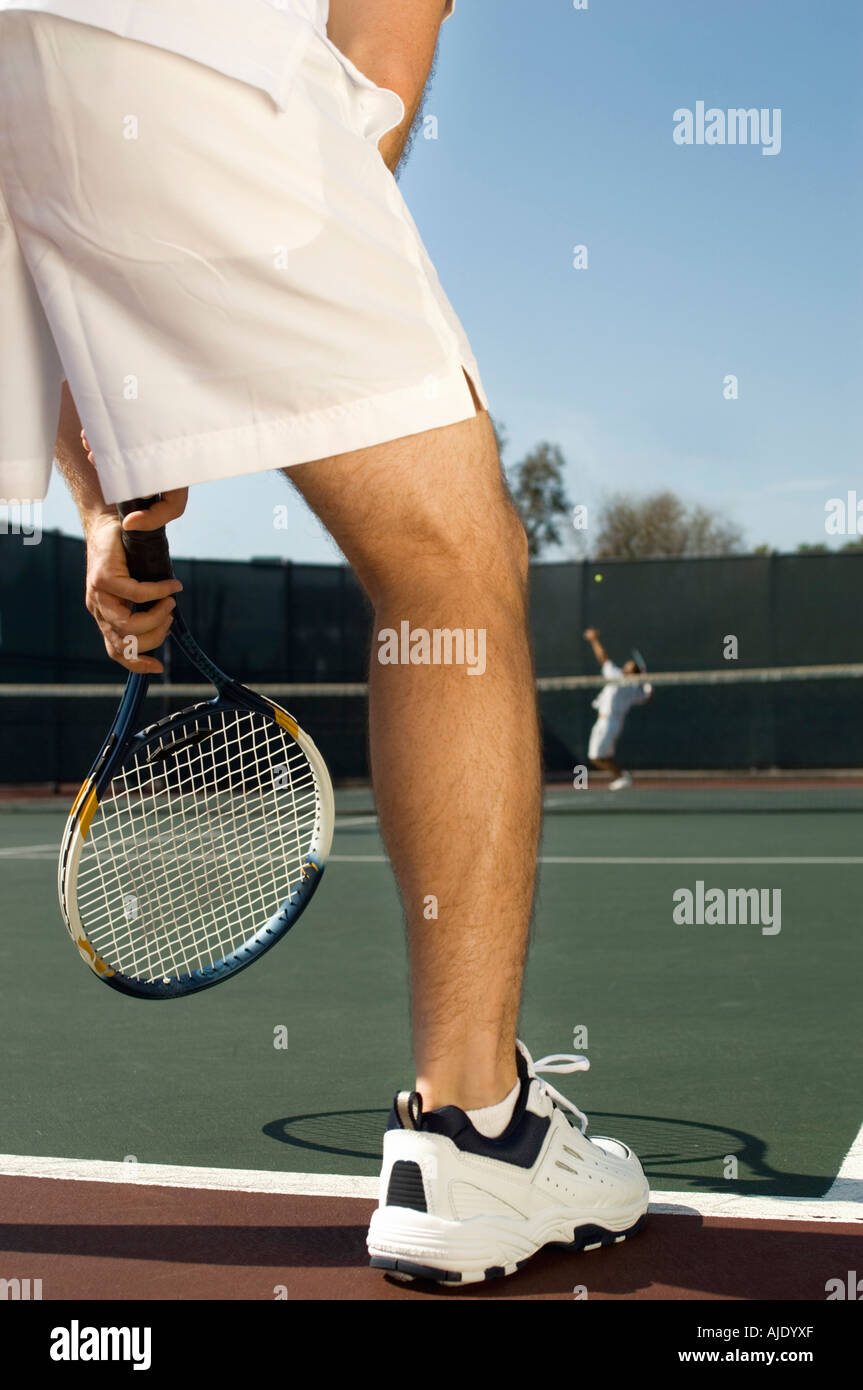 Tennis Player holding tennis racket, Waiting For Serve, low section ...