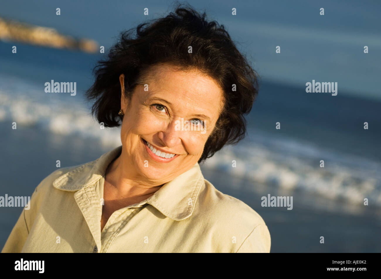 Woman at ocean, smiling, (close-up), (portrait Stock Photo - Alamy