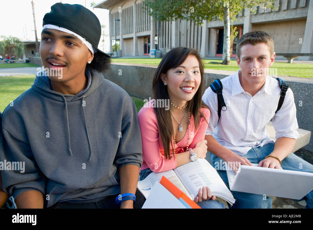 Three friends outside school Stock Photo - Alamy
