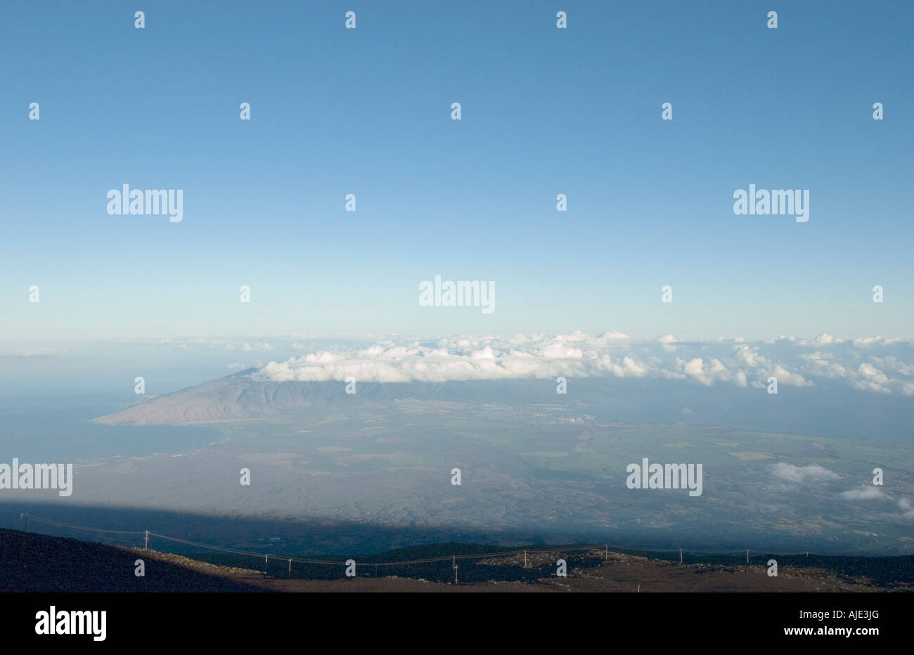 Sunrise (dawn) and view of West Maui and Lanai seen from the summit of ...