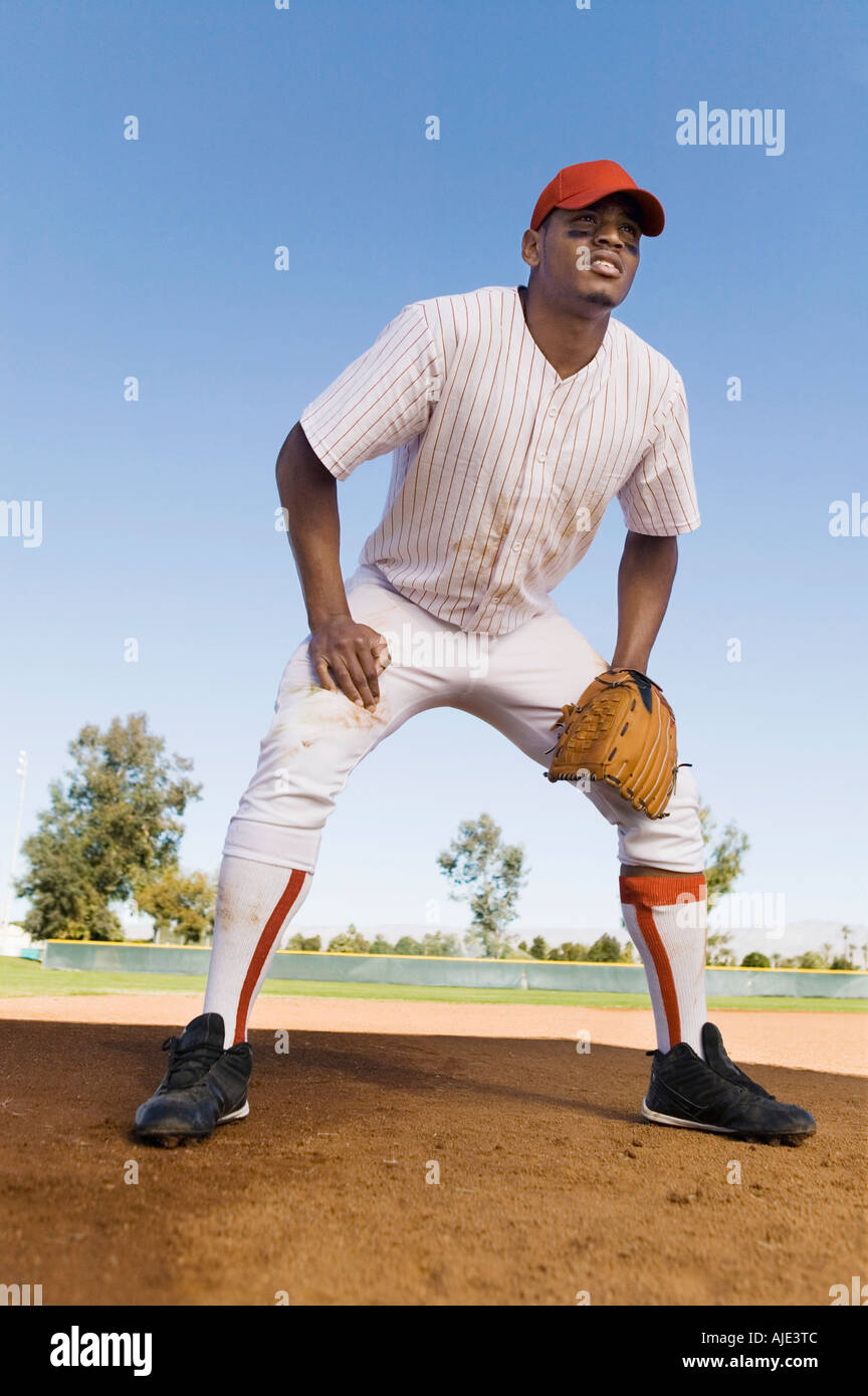 Baseball infielder on mound during game Stock Photo - Alamy
