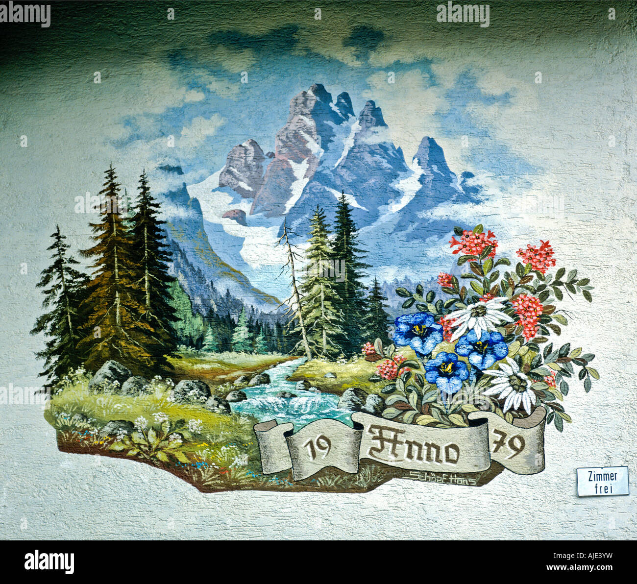 A pretty mural of a Bavarian landscape painted on the outside wall of a ...