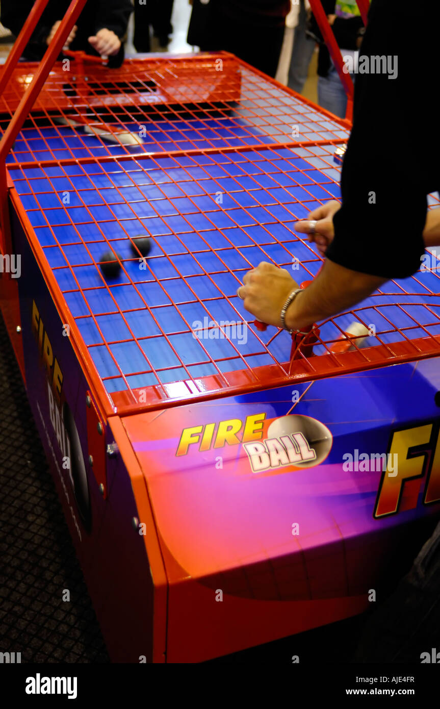 People playing Fire Ball table game Stock Photo - Alamy