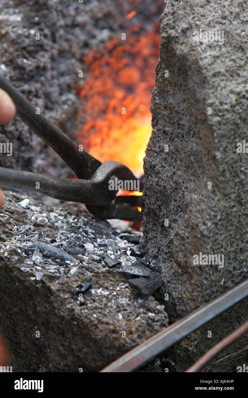 metal being heated in a blacksmiths forge Stock Photo - Alamy