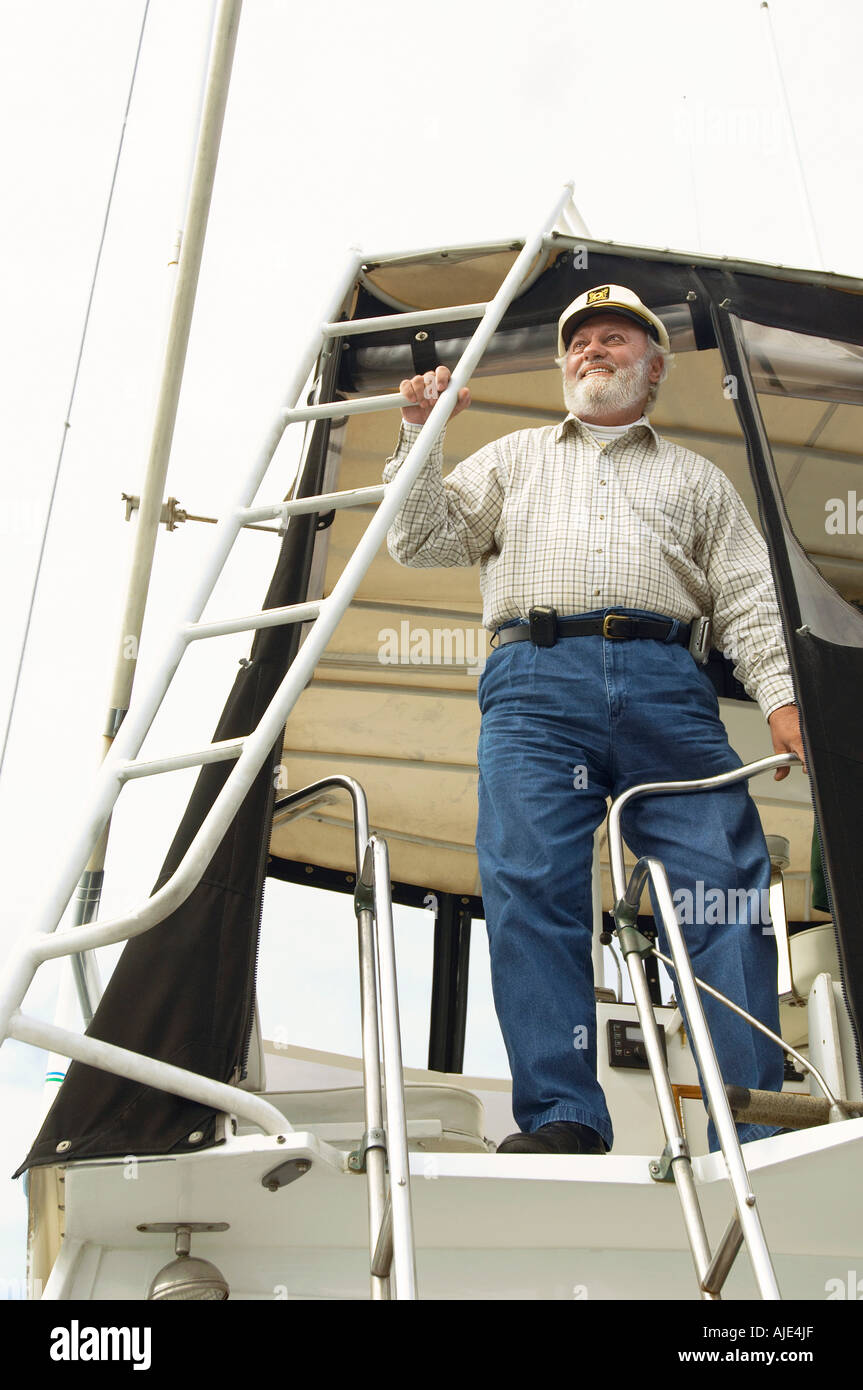 Captain on boat Stock Photo - Alamy