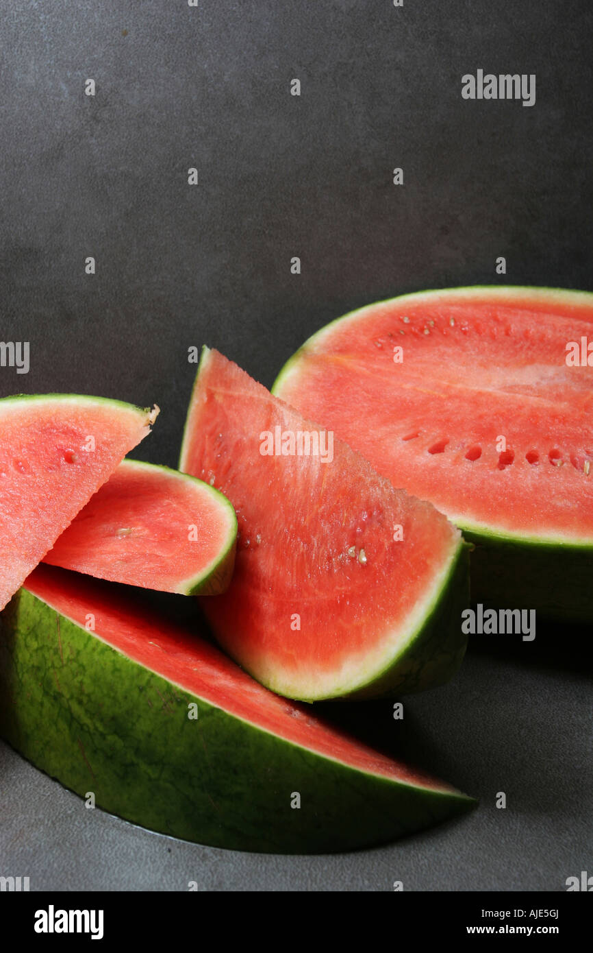 cut watermelon on a darkgrey background Stock Photo - Alamy