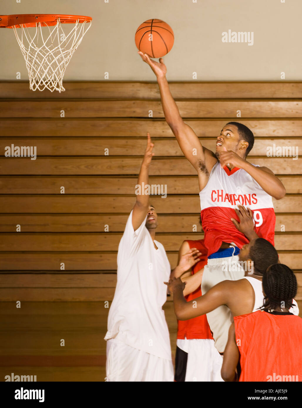 Basketballer performing lay-up in match Stock Photo - Alamy