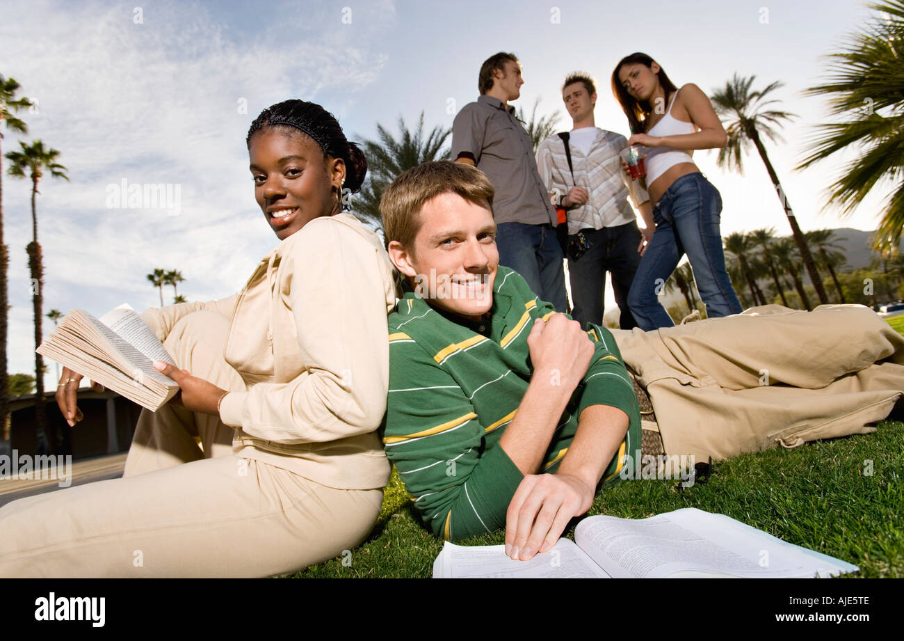 College students on campus lawn, studying Stock Photo - Alamy