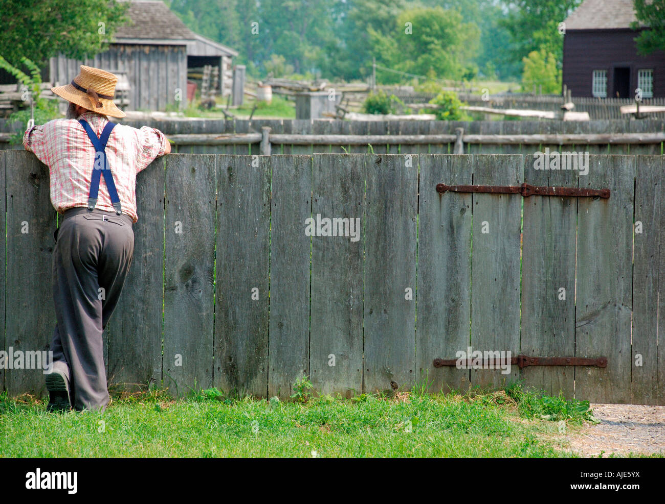 Man looking over fence hi-res stock photography and images - Alamy