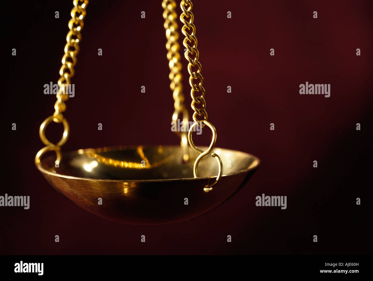 Shiny golden empty unbalanced vintage justice scales Stock Photo - Alamy