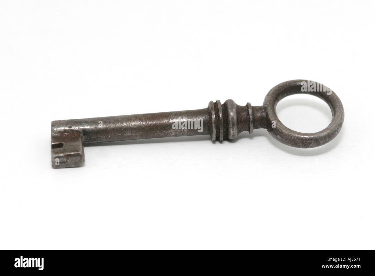 An old vintage key on white background Stock Photo - Alamy