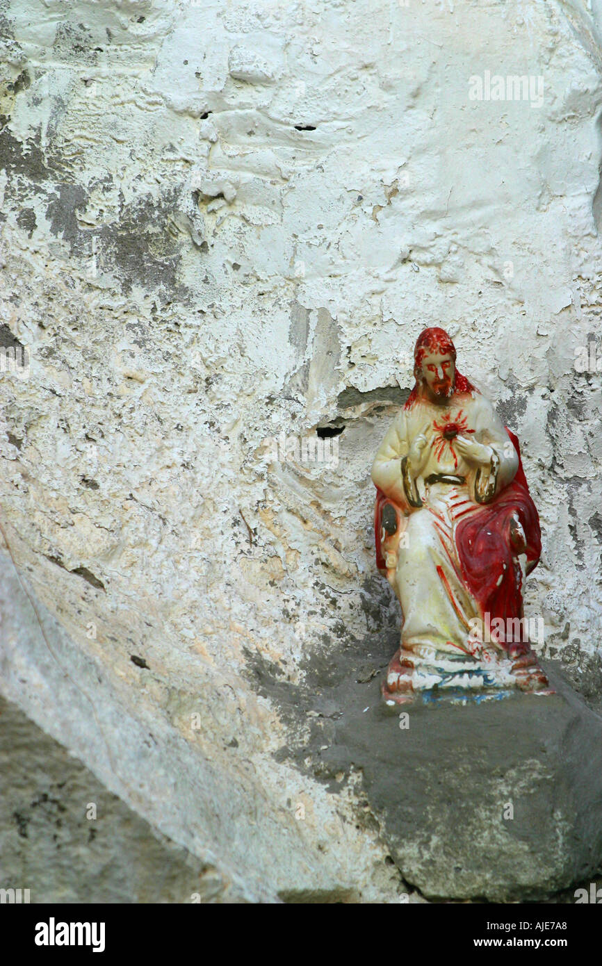 A religious statue of Jesus outside a house in Puerto De Mogan Gran ...