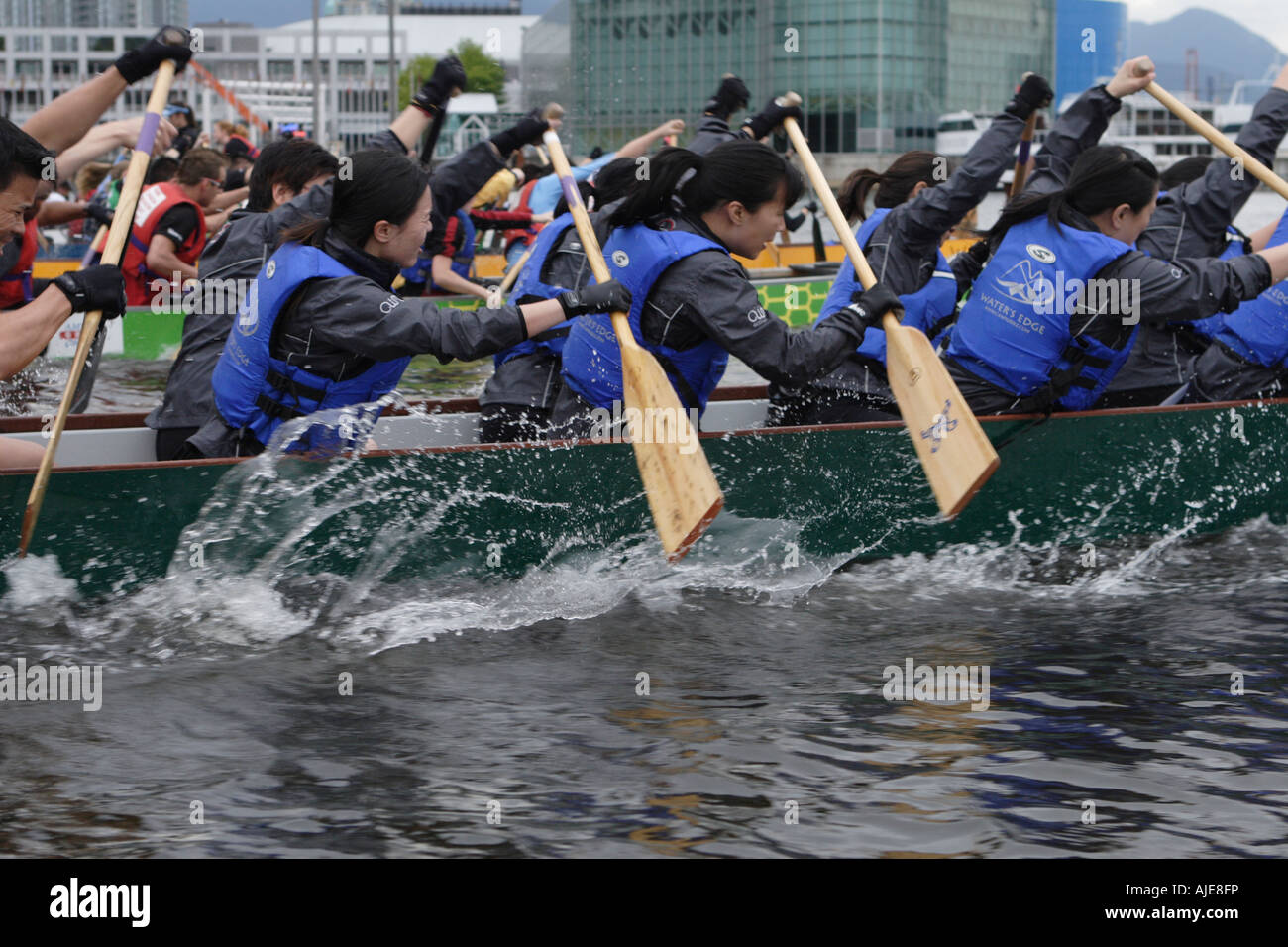 Team dragon boat racing, working together Stock Photo - Alamy