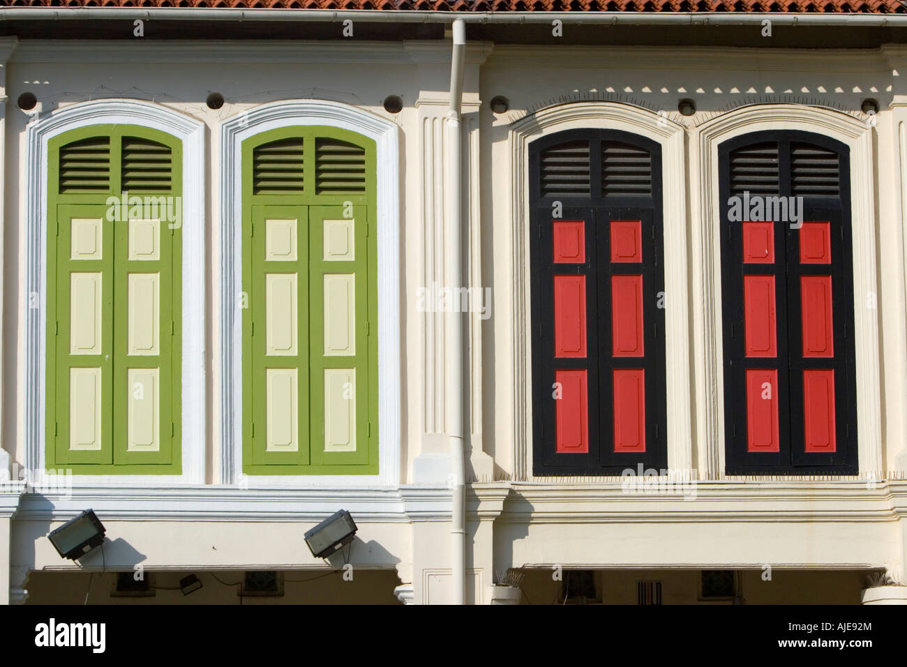 Pastel louvre and panel shop house windows Singapore Stock Photo - Alamy