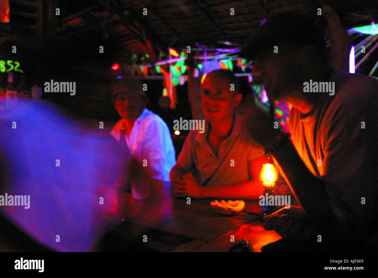 Travellers buy drinks and enjoy a full moon party at Guy s bar Hat Tian ...