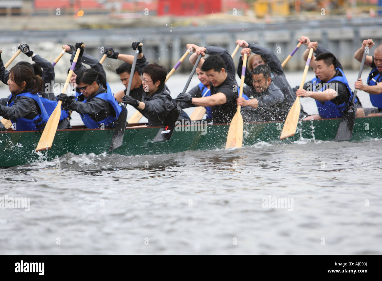 Team dragon boat racing, working together Stock Photo - Alamy