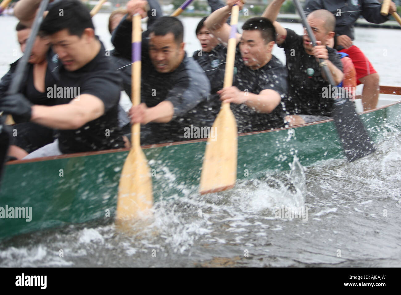 Team dragon boat racing, working together Stock Photo - Alamy