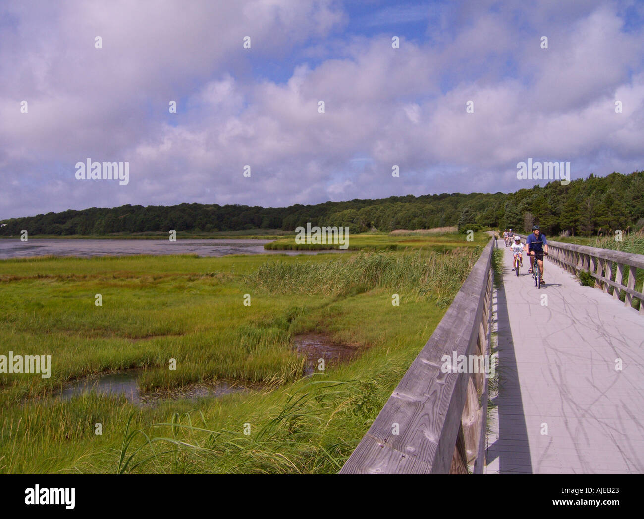Massachusetts Cape Cod National Seashore family bicycling on causeway ...