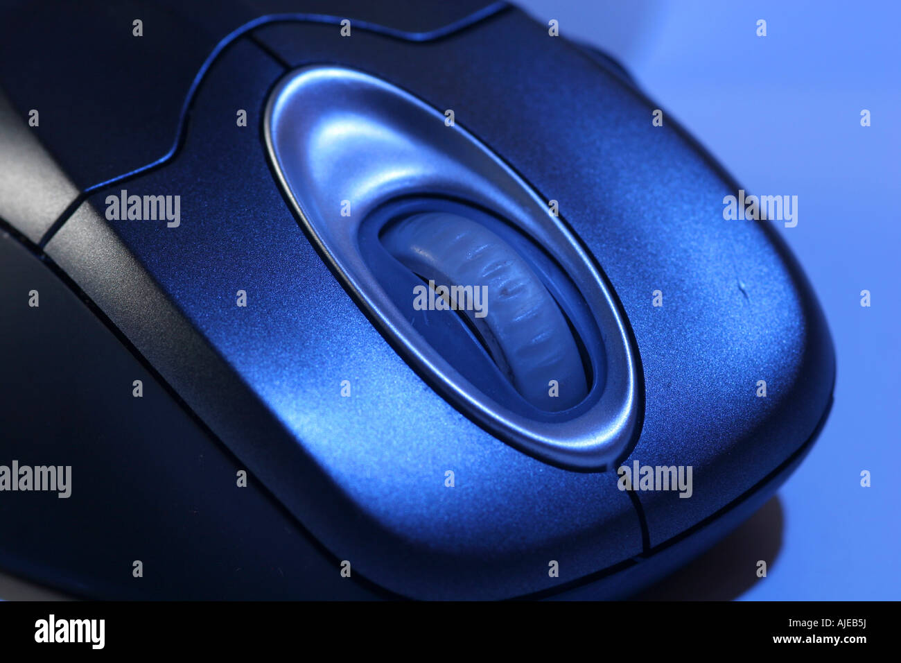 A wireless mouse in blue light Stock Photo - Alamy