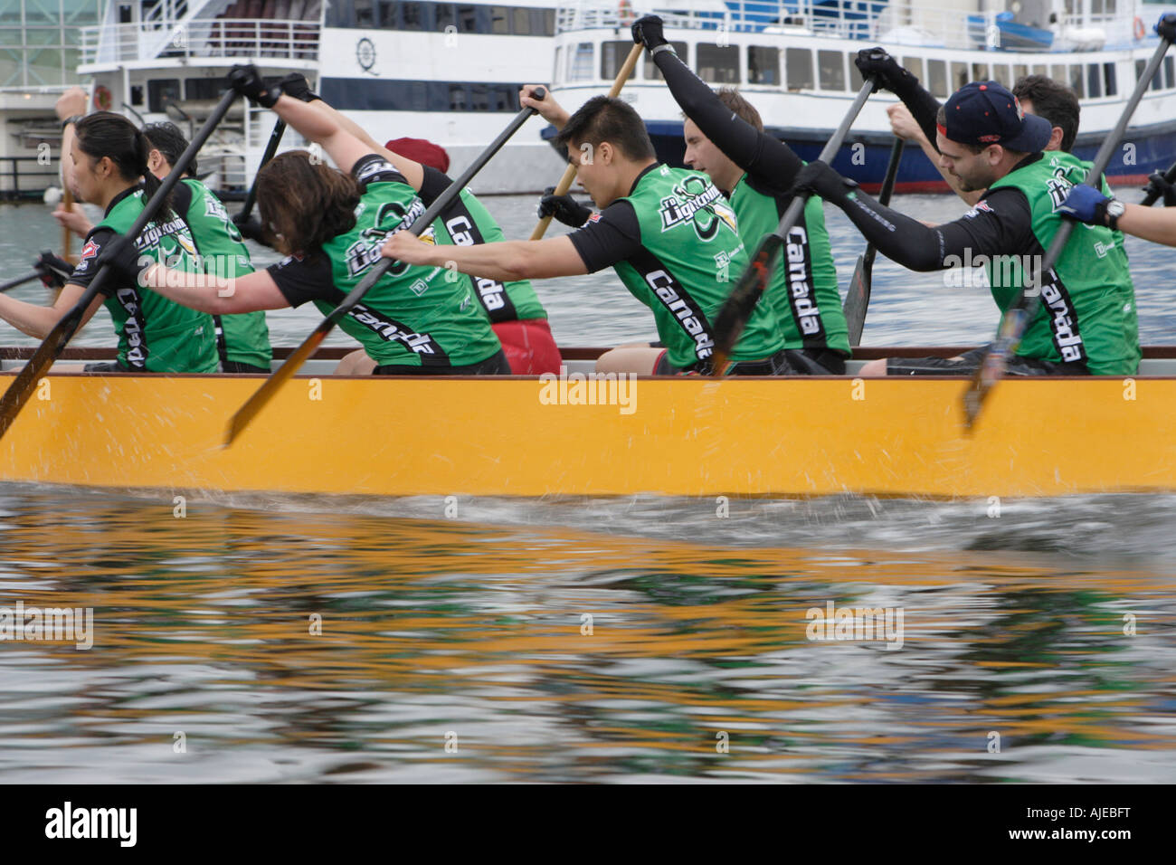 Team dragon boat racing, working together Stock Photo - Alamy