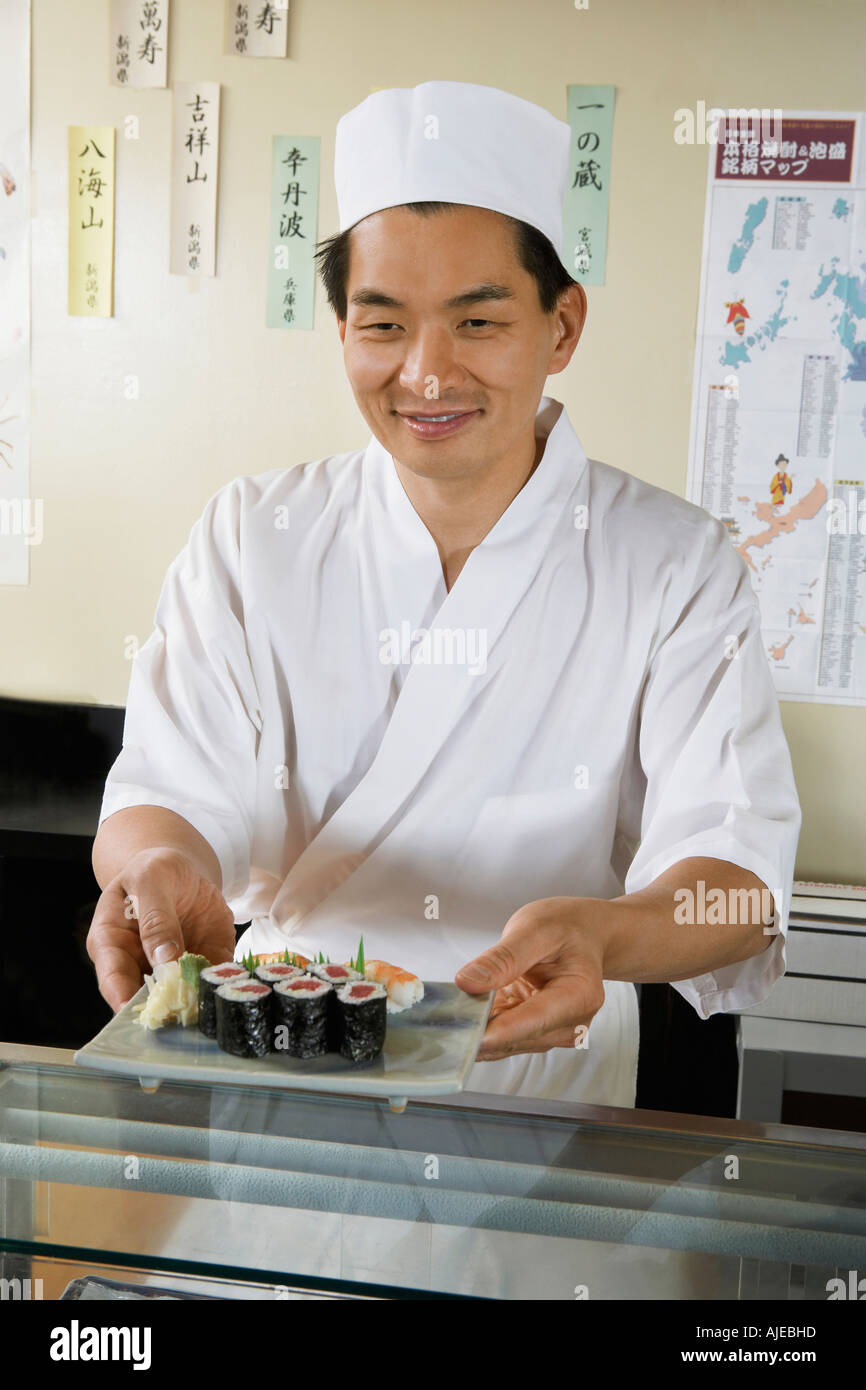 Sushi chef holding plate hi-res stock photography and images - Alamy